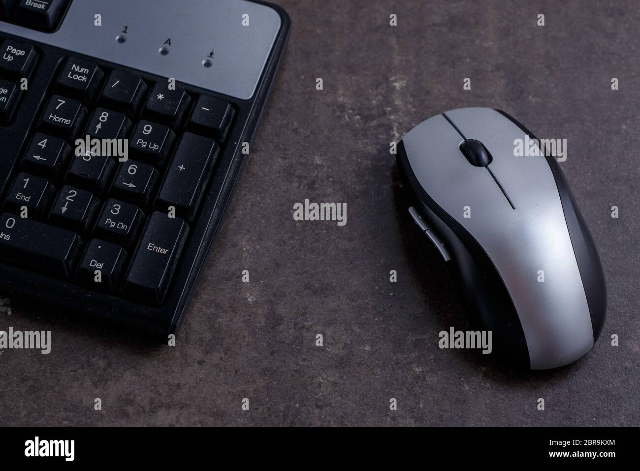 black keyboard and black and grey computer mouse on grey marble Stock ...