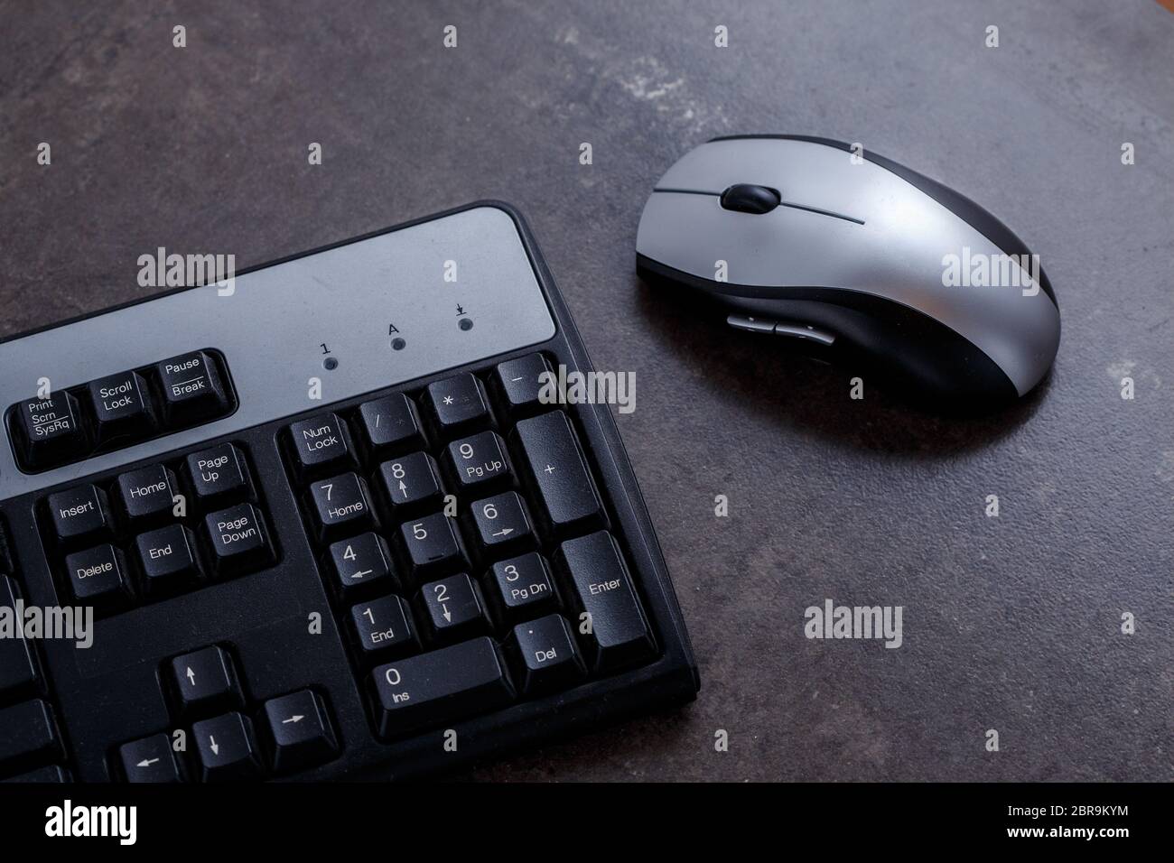 black keyboard and black and grey computer mouse on grey marble Stock ...