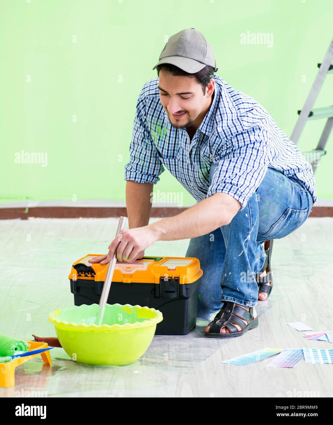 The young man doing home renovation Stock Photo - Alamy