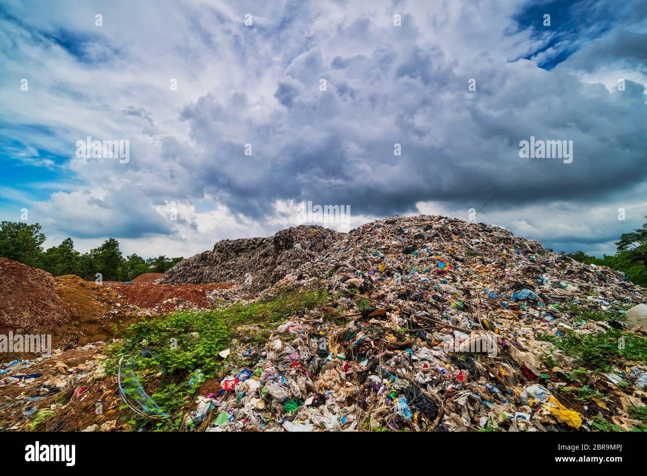 Garbage Dump Hill, landscape with landfill and clouds Stock Photo - Alamy