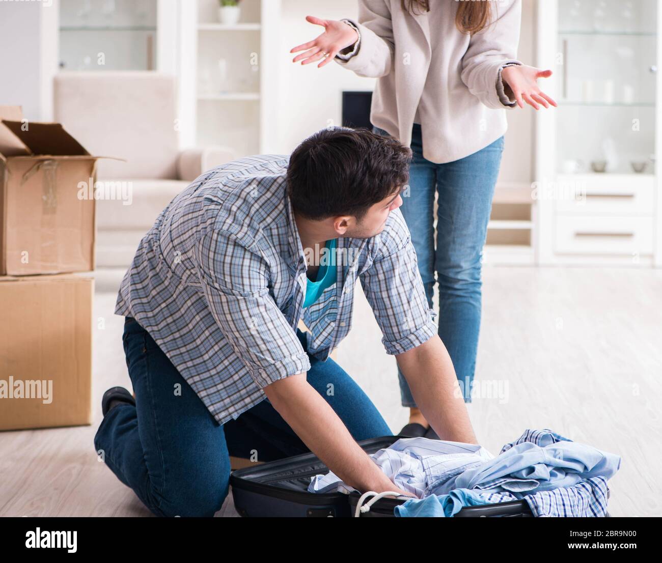 The woman evicting man from house during family conflict Stock Photo ...