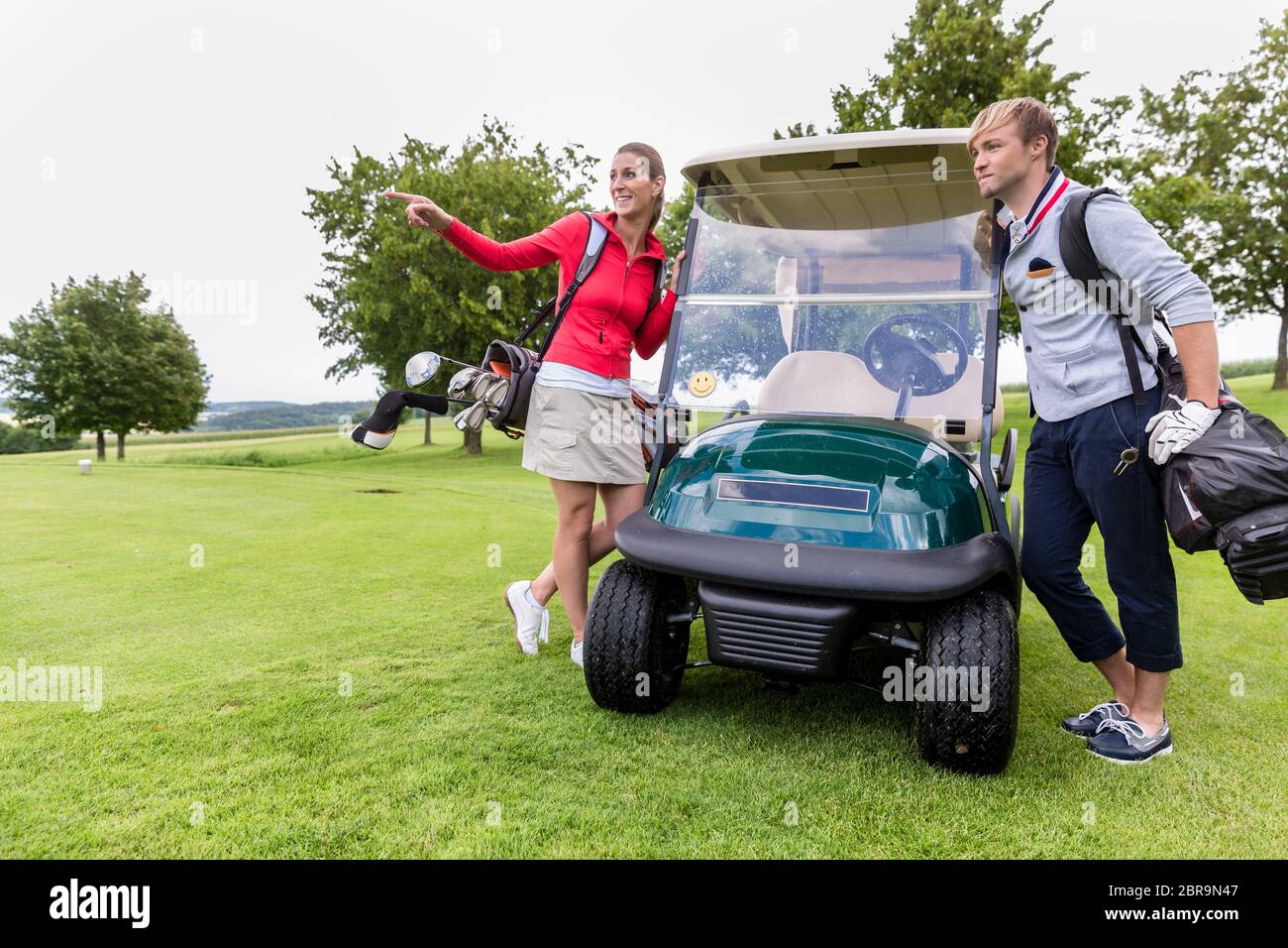 Smiling woman near cart hi-res stock photography and images - Alamy