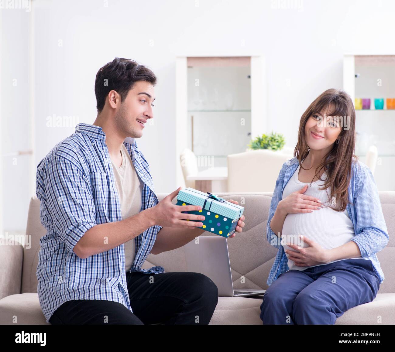 The happy family celebrating pregnancy at home Stock Photo - Alamy