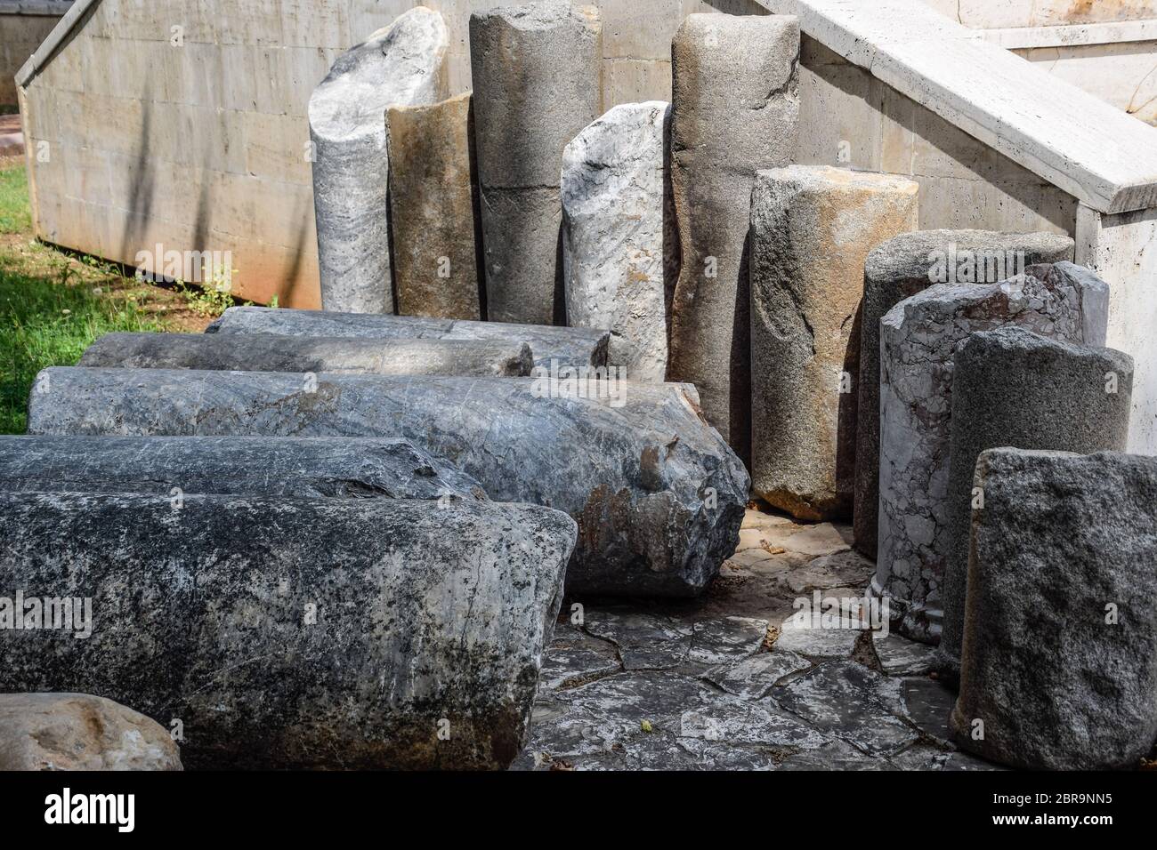 Pieces of destroyed antique columns. Columns of marble and granite ...