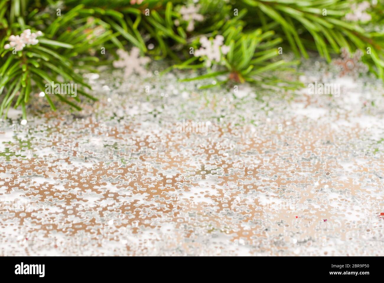 fir tree branch and snow flares confetti with copy space. Merry ...