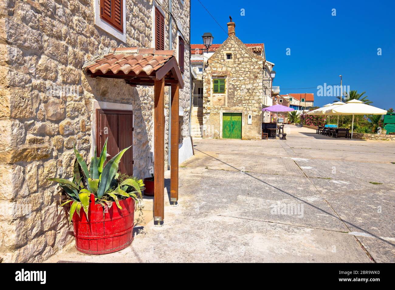 Mediterranean stone village on Krapanj island view, sea sponge ...