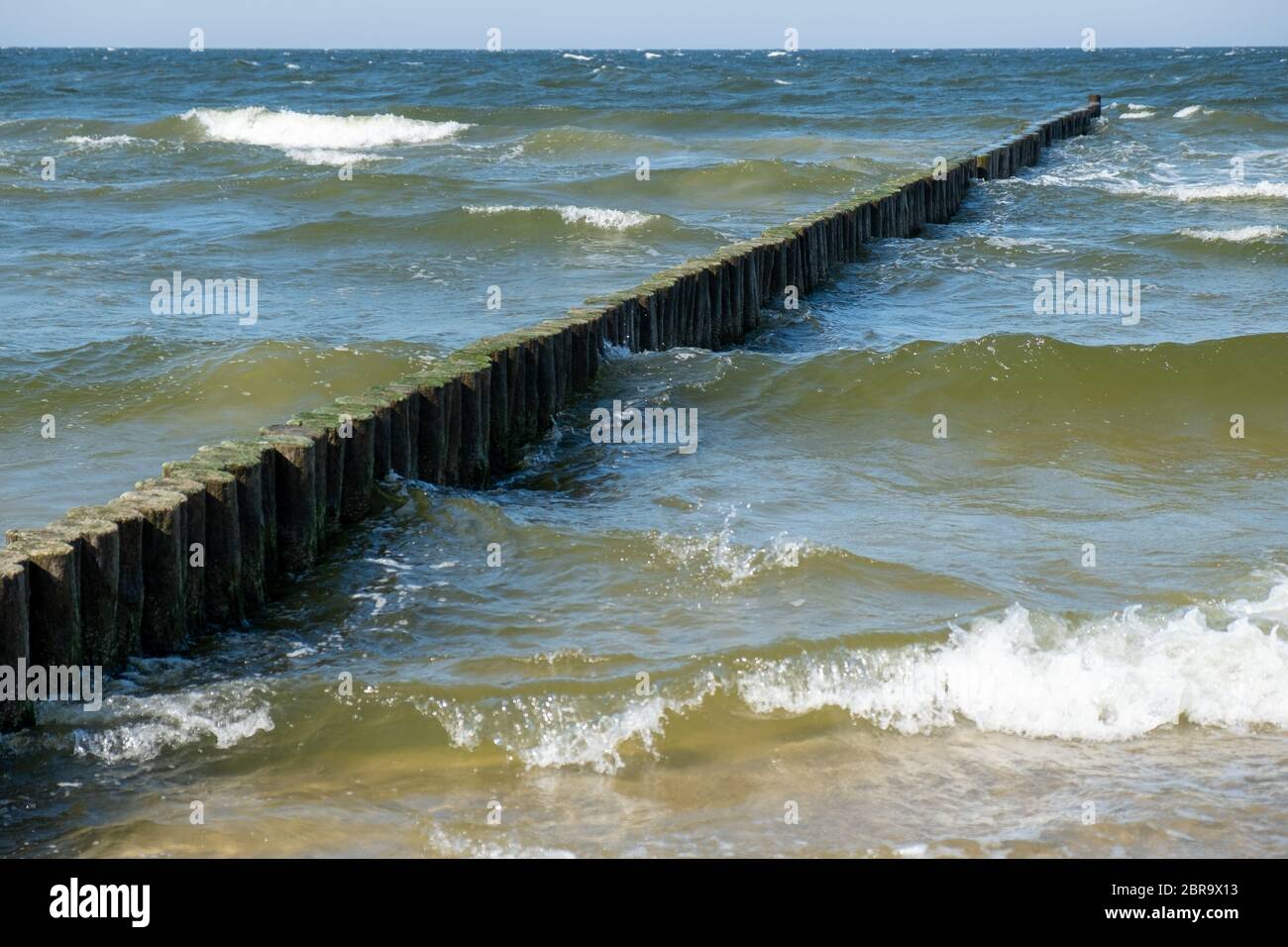 View to the Baltic Sea with its groynes at the beach of Zempin Stock ...