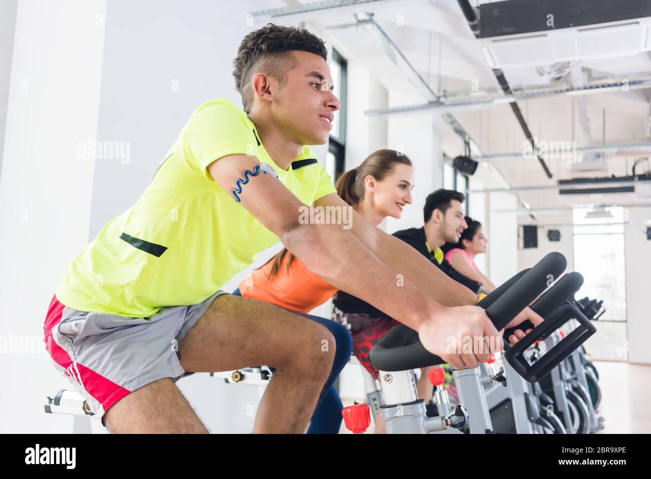 Side view of a man exercising on bicycle Stock Photo - Alamy