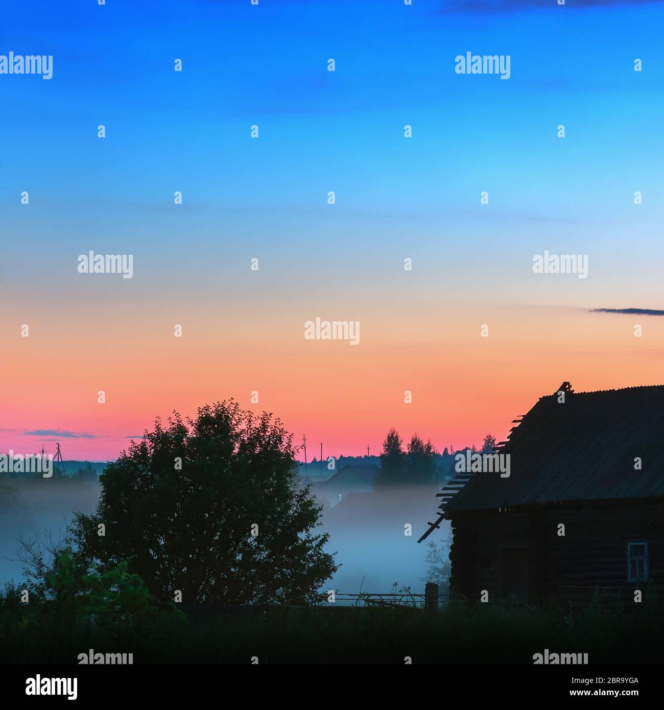 Summer night rural landscape - dense fog in the village under a ...