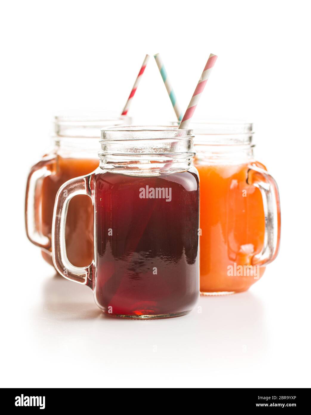 Glass of fruity juice with straw isolated on white background Stock ...