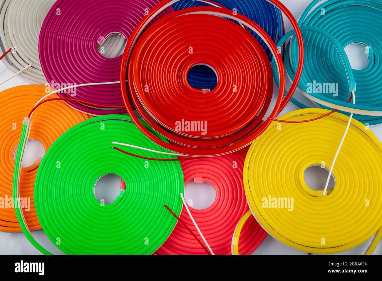 Flexible led tape neon flex in different colors on white background ...