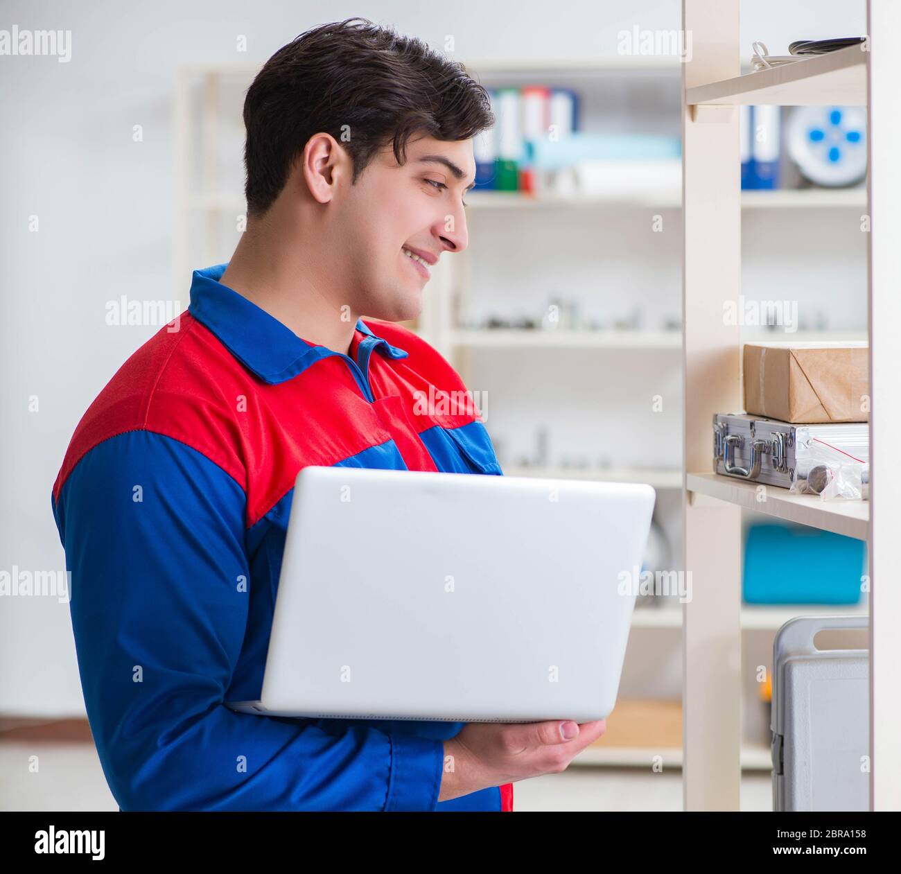 The man working in the postal warehouse Stock Photo - Alamy