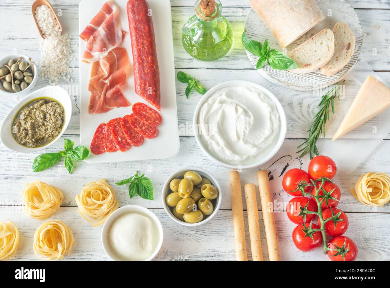 Assortment of Italian foods on the wooden table Stock Photo - Alamy