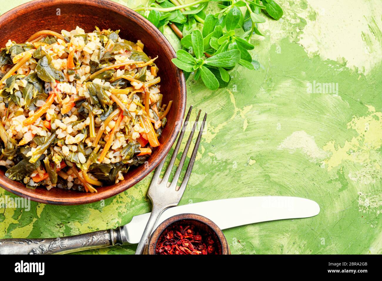 Popular food of the Middle East.Stew bulgur.Bulgur with portulak Stock ...