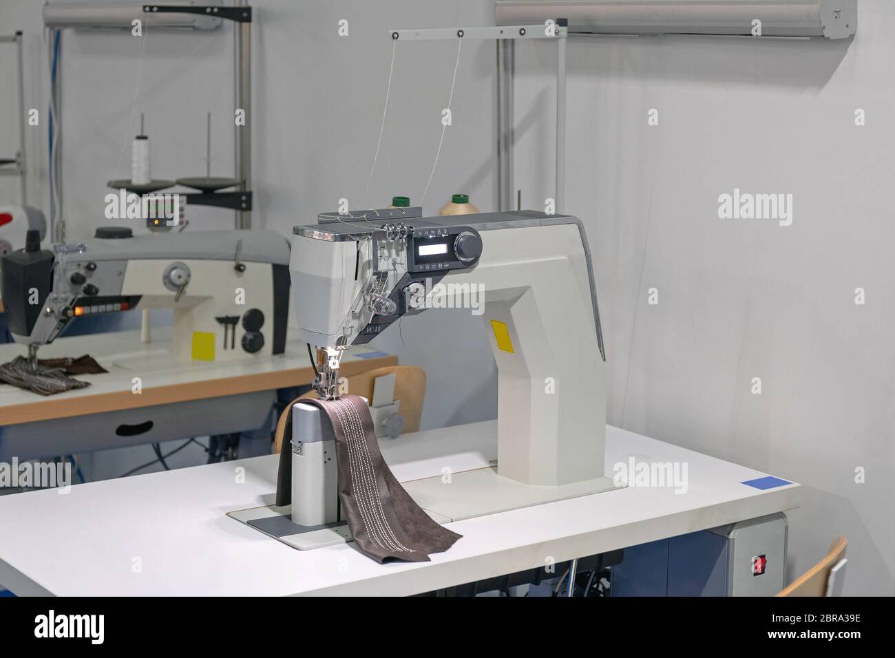 Sewing Machines in Garment Clothing Work Shop Stock Photo - Alamy