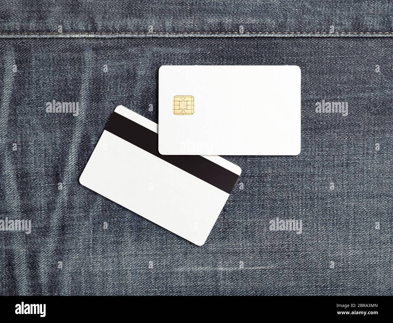 Bank cards mock-up. Blank white plastic credit cards on denim ...