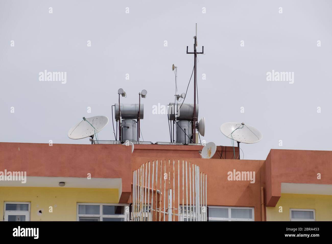 Steel barrels of boilers with water on the roof of a building to heat ...
