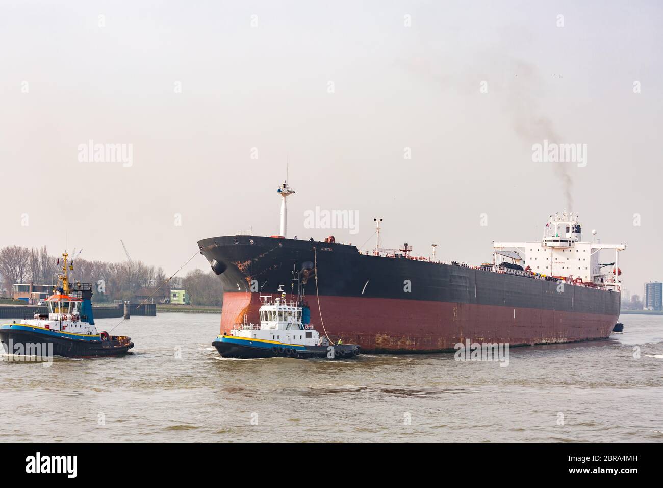 Big Cargo Containers Boat with Goods cargo Stack at the Pier docks port ...