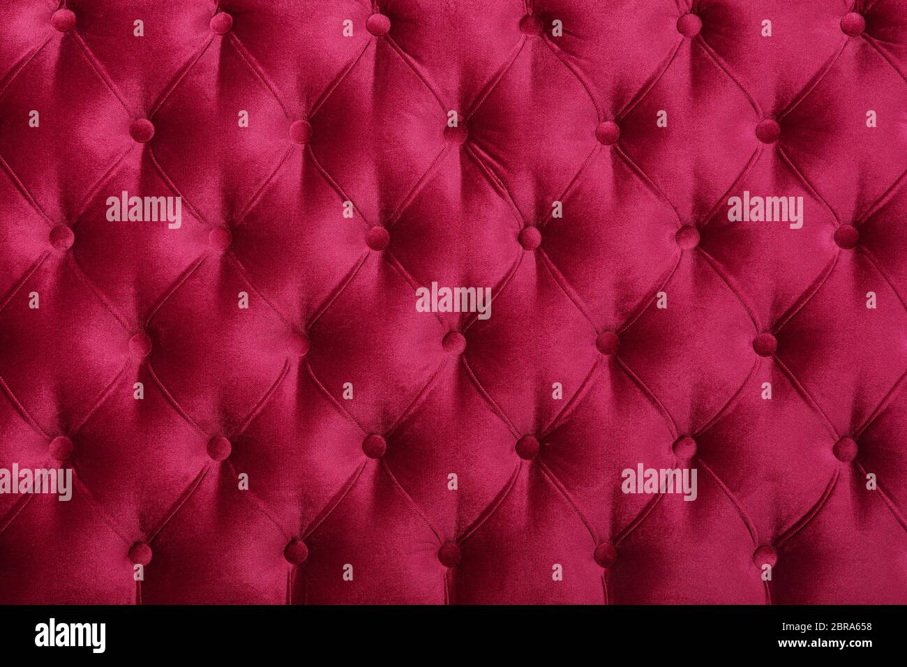 Burgundy dark red velvet capitone textile background, retro ...
