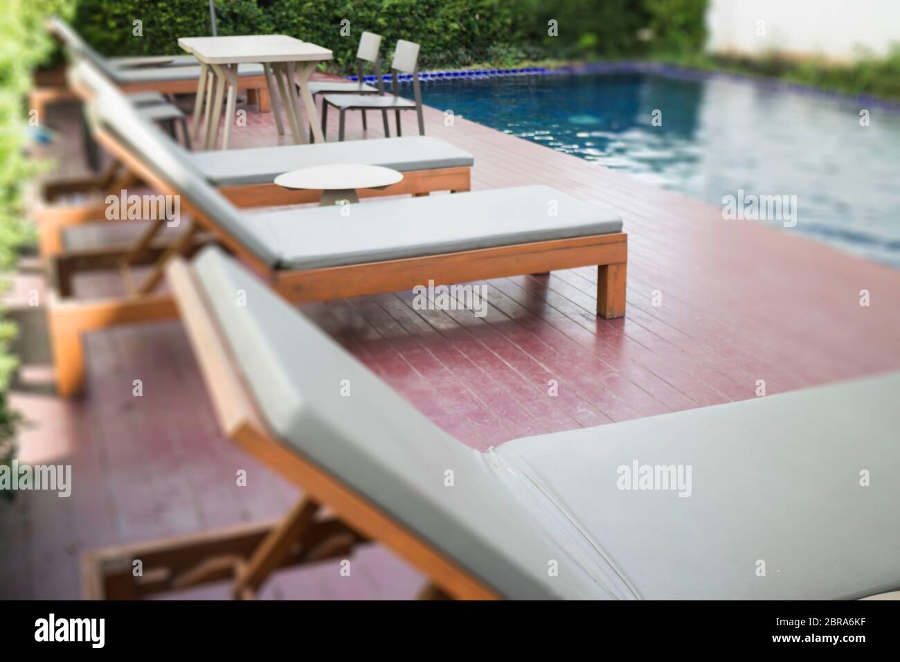 Bench at swimming pool in the hotel, stock photo Stock Photo - Alamy