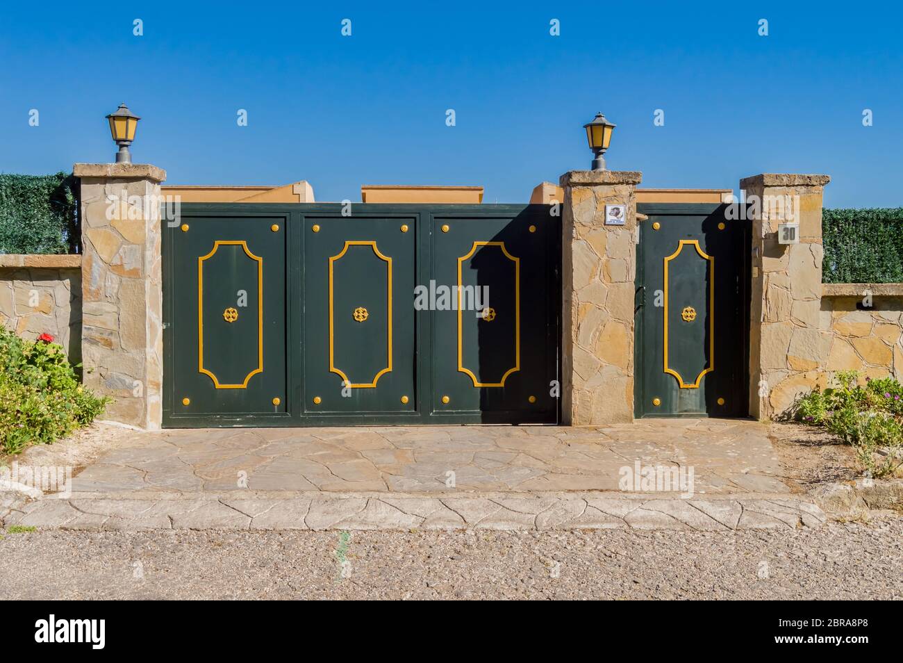 Elegant house entrance portico with natural wood double doors and ...