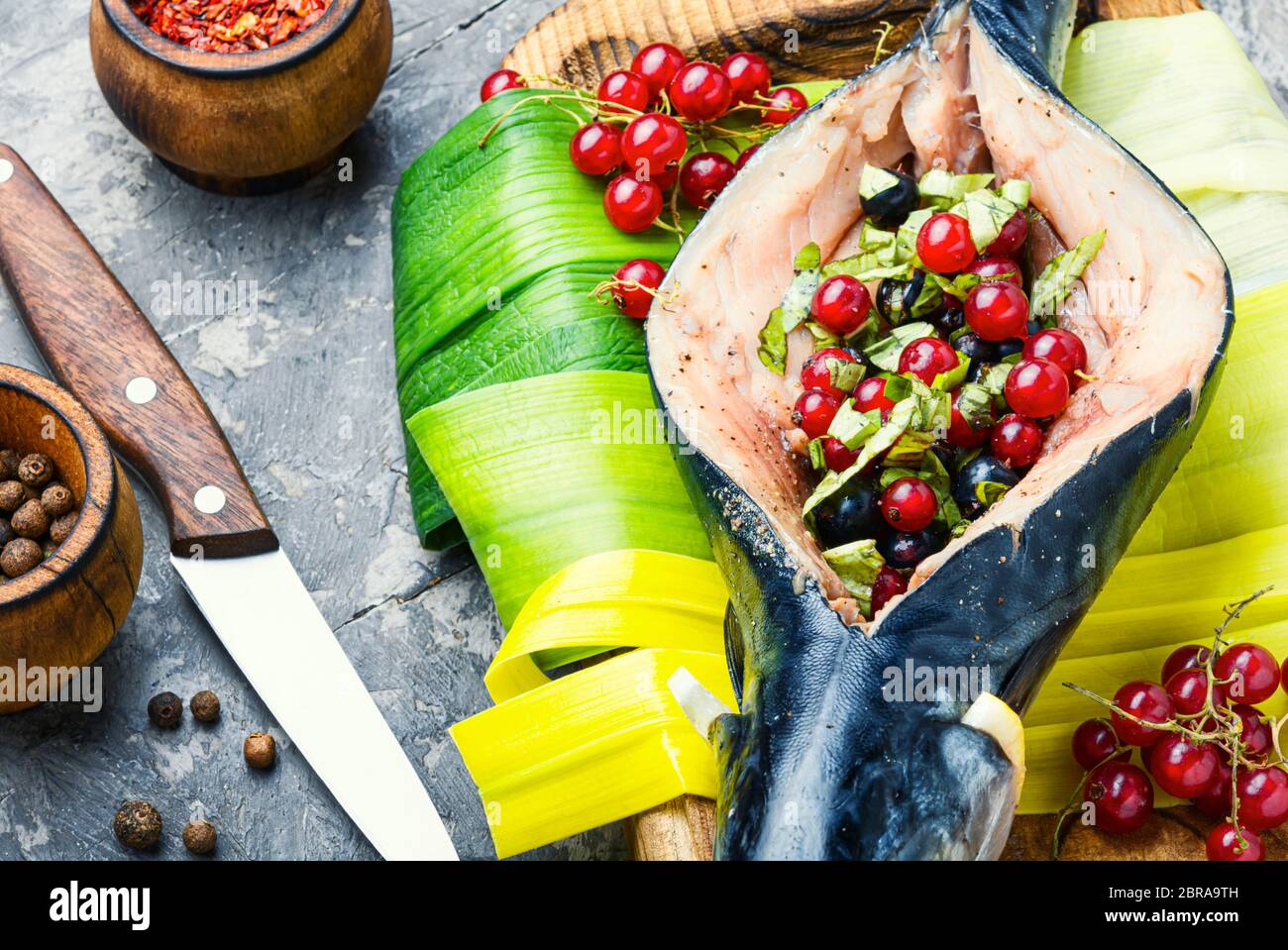 Raw fresh whole mackerel stuffed with berries.Fish with currant filling ...