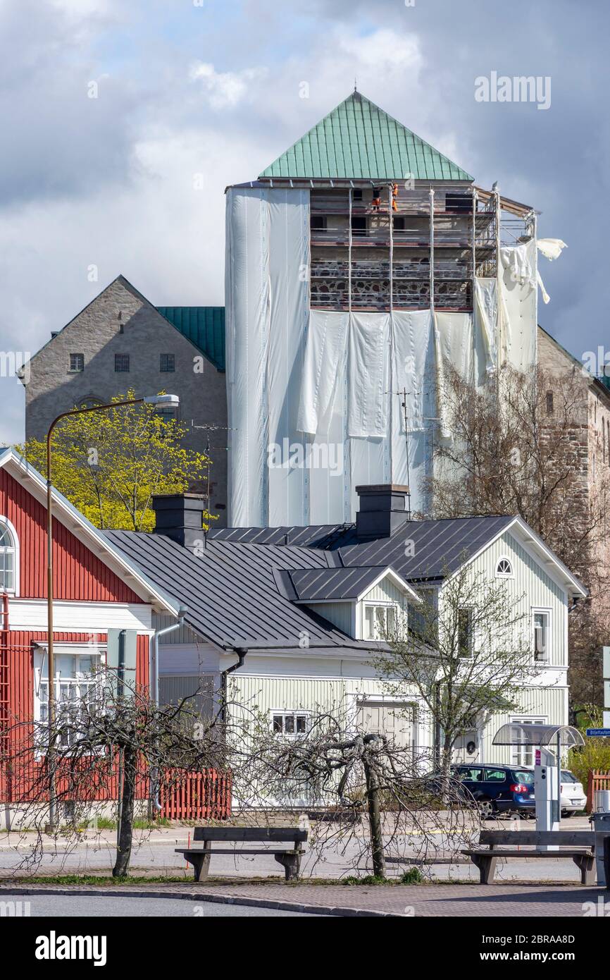 Wooden houses and medieval Turku castle under renovation in the ...