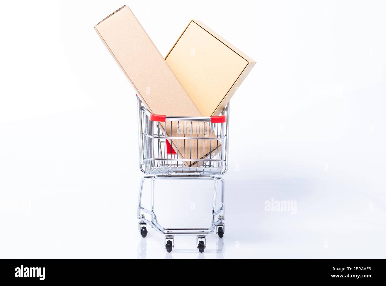 Front view of a shopping trolley with parcels, isolated on white ...