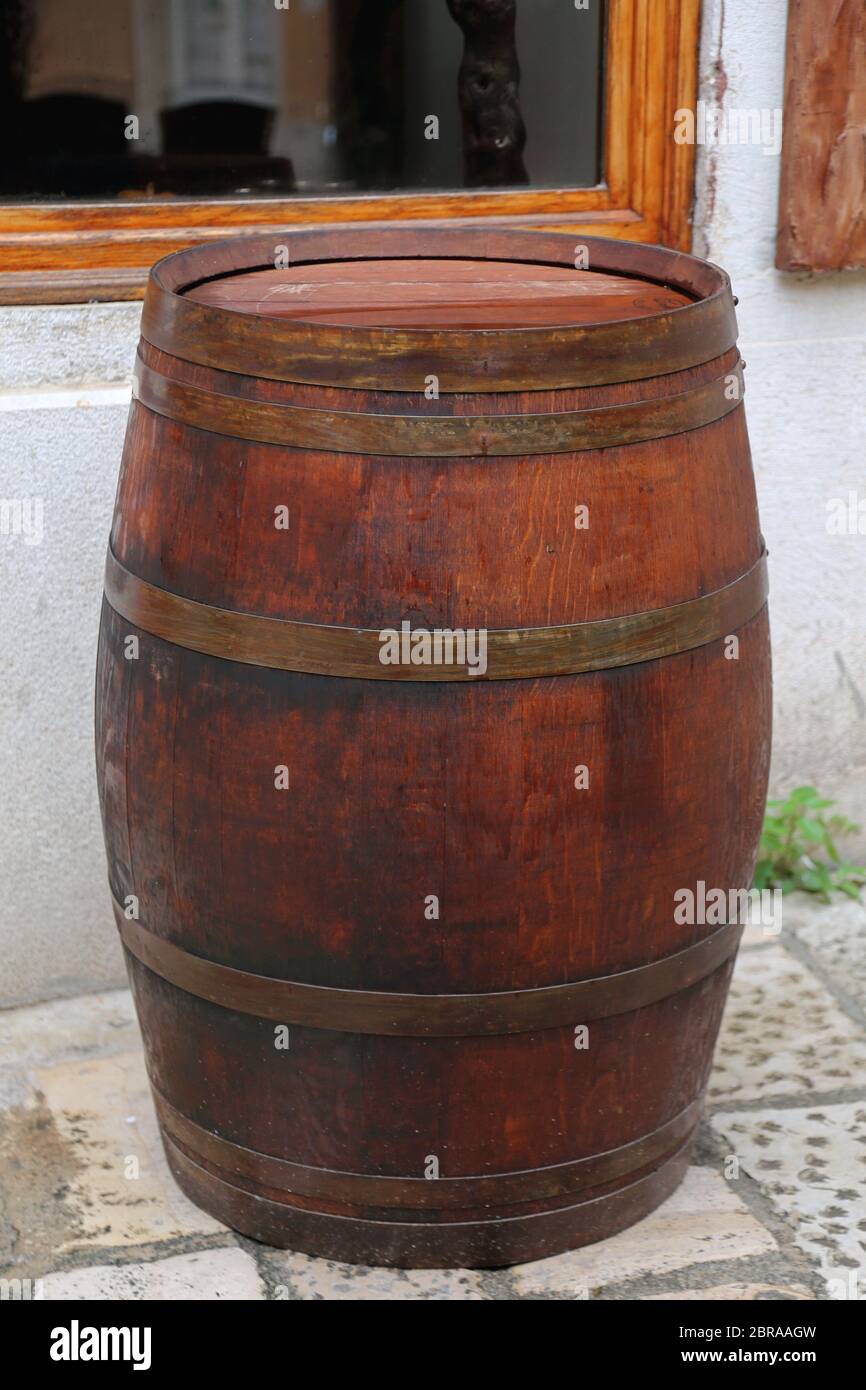 Old Brown Wooden Barrel in Front of Building Stock Photo - Alamy