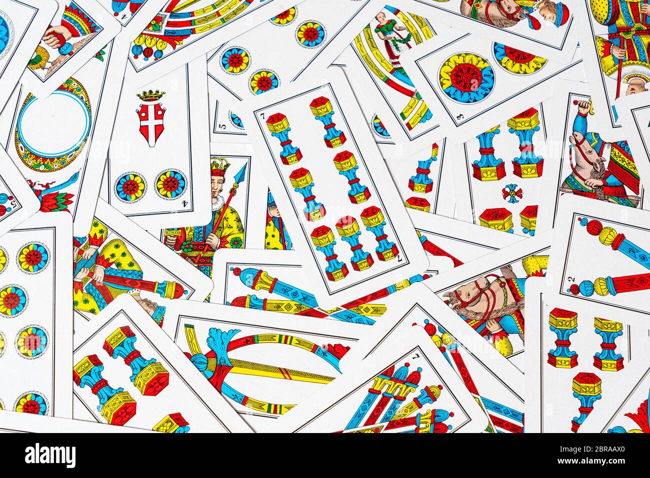 some Cards for the briscola game on a white table Stock Photo - Alamy