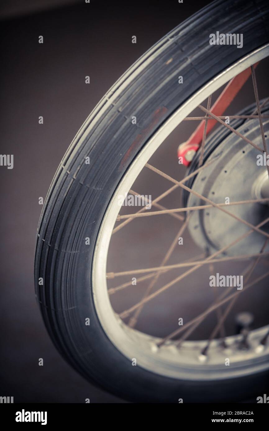 Color image of a vintage thin motorcycle wheel Stock Photo - Alamy