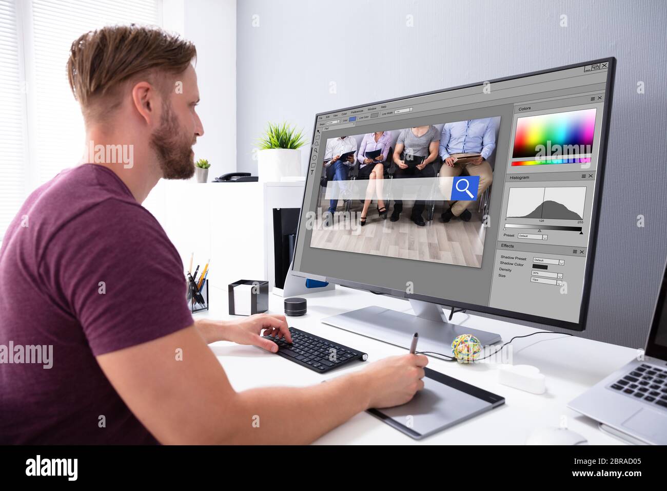 Designer Editing Photo On Computer In Office Stock Photo - Alamy