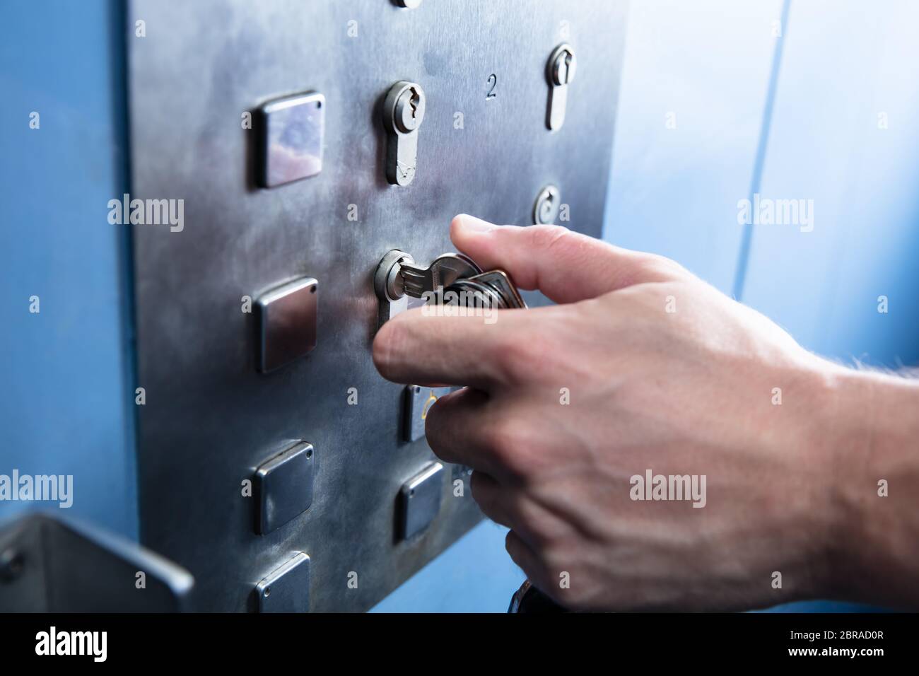 Close up hand turning key hi-res stock photography and images - Alamy