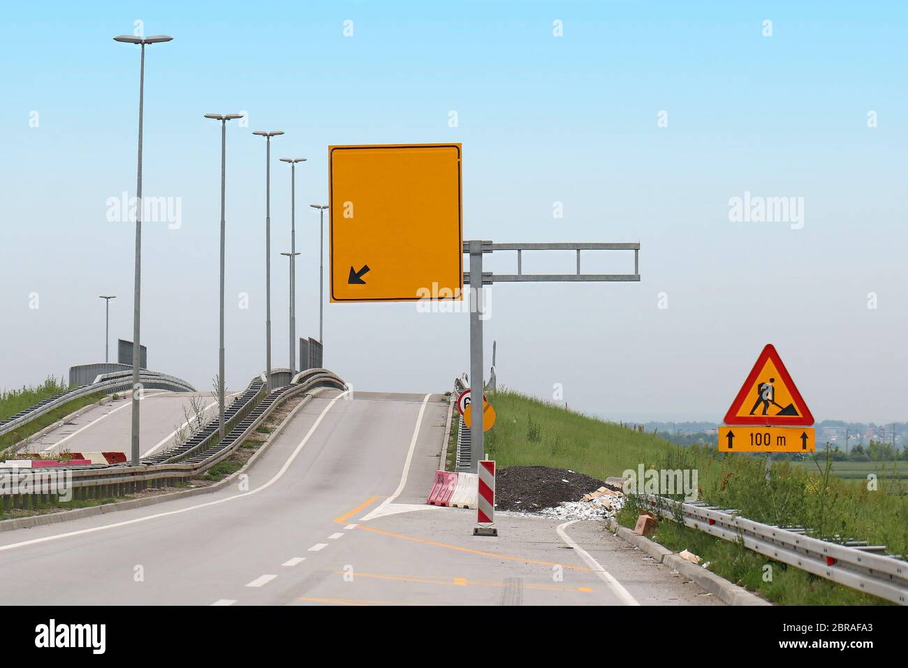 Empty road without traffic on highway with road works sign Stock Photo ...