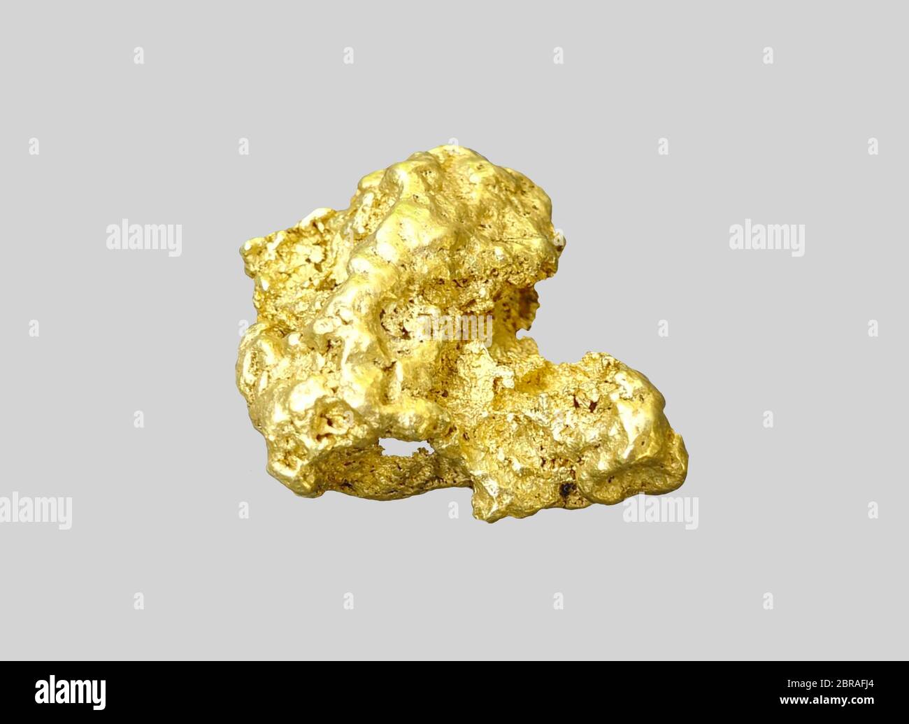 Gold nugget, metal on an isolated background Stock Photo - Alamy