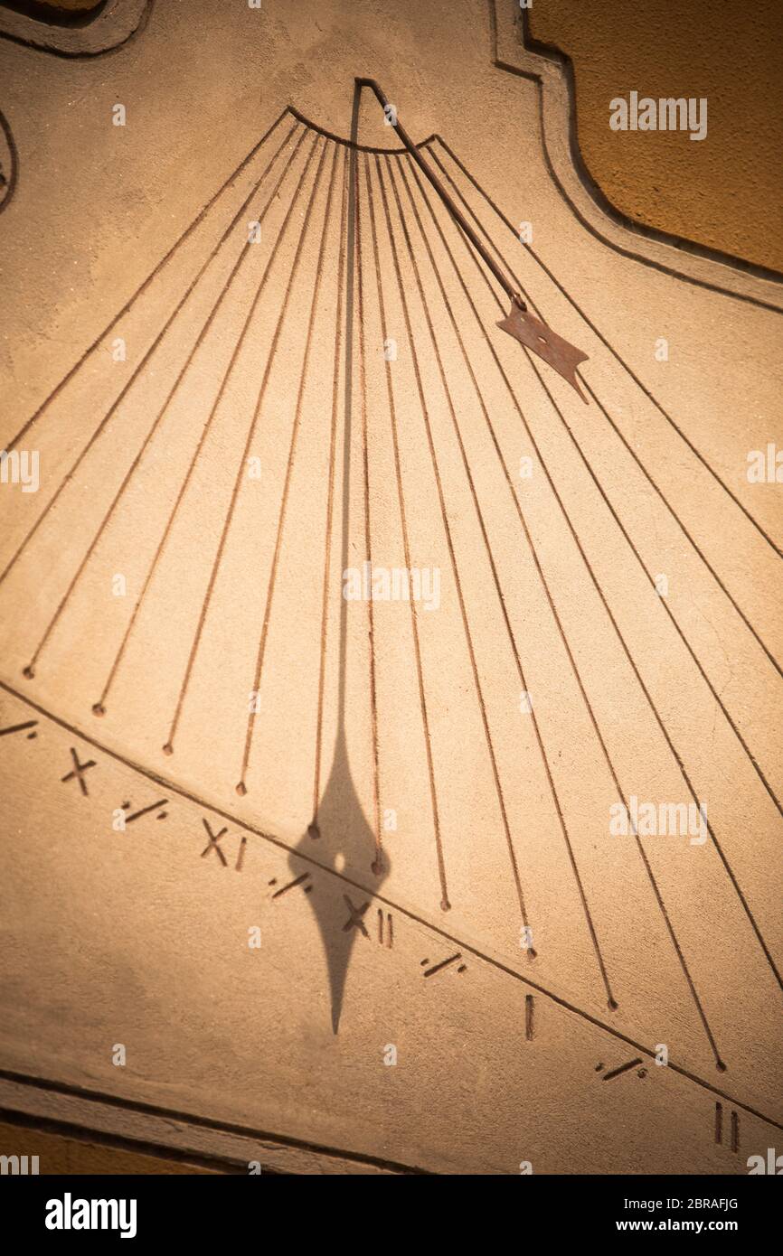 Color image of a vintage sundial on a wall Stock Photo - Alamy