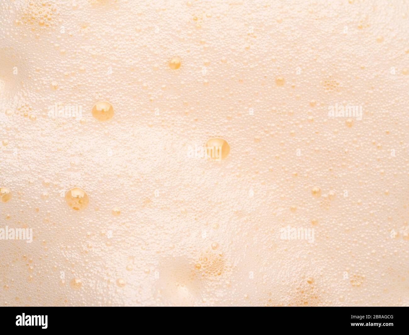 Foam texture extreme close up as background. Milkshake or cappucino ...