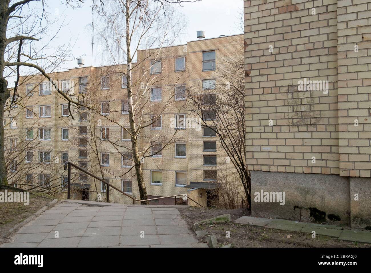 Walkway and stairs in front of an old, Communist, USSR apartment ...