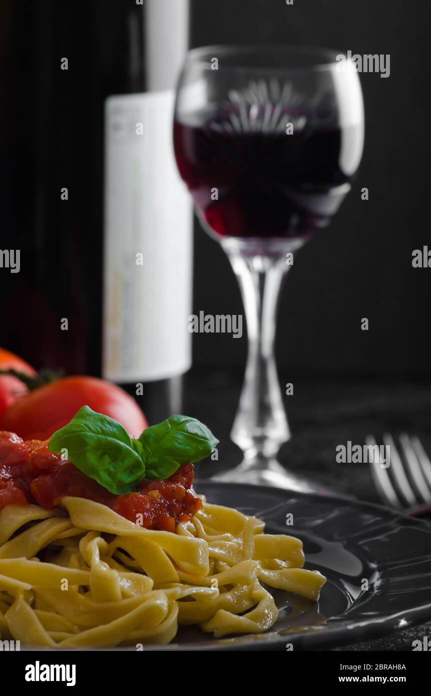 Semolina pasta with spicy tomato salsa, garlic and basil Stock Photo ...