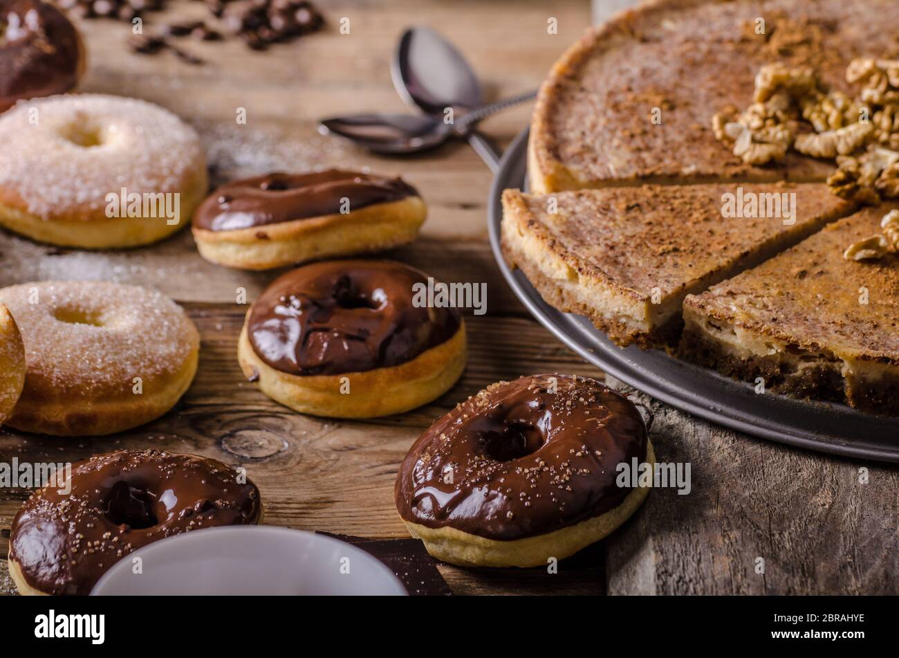 Old style donuts with sugar and dark chocolate, whole table, place for ...