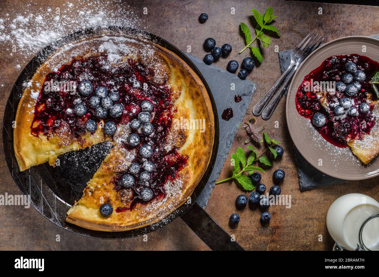Dutch style pancake named dutch baby, baked in oven on iron skillet ...