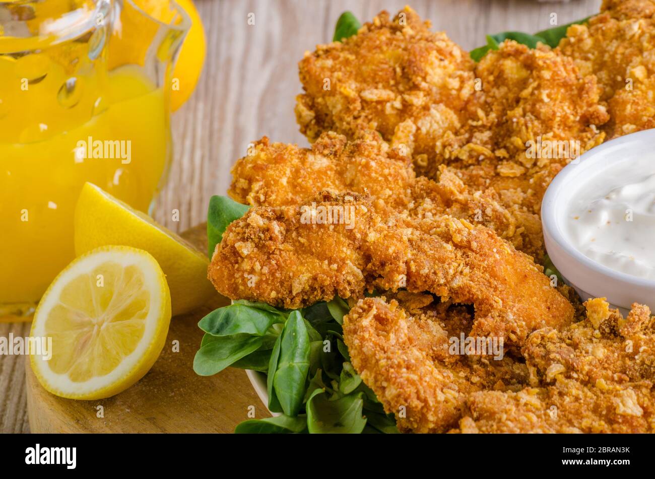 Chicken strips with delish garlic dip, food photography Stock Photo - Alamy