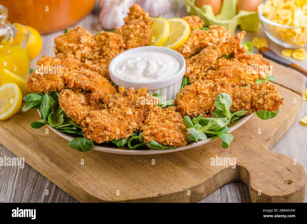 Chicken strips with delish garlic dip, food photography Stock Photo - Alamy