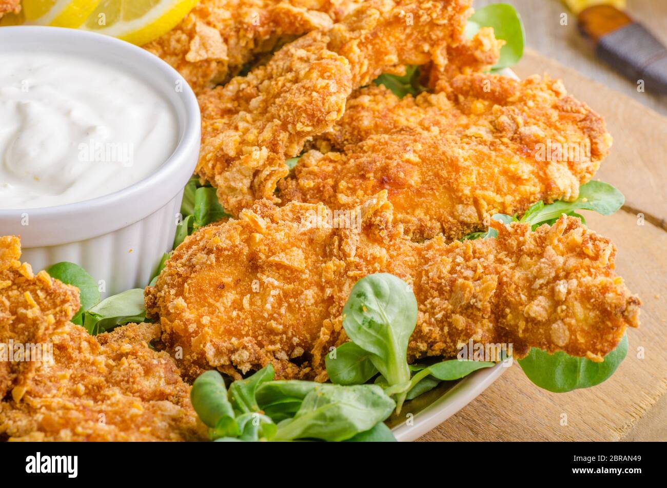 Chicken strips with delish garlic dip, food photography Stock Photo - Alamy