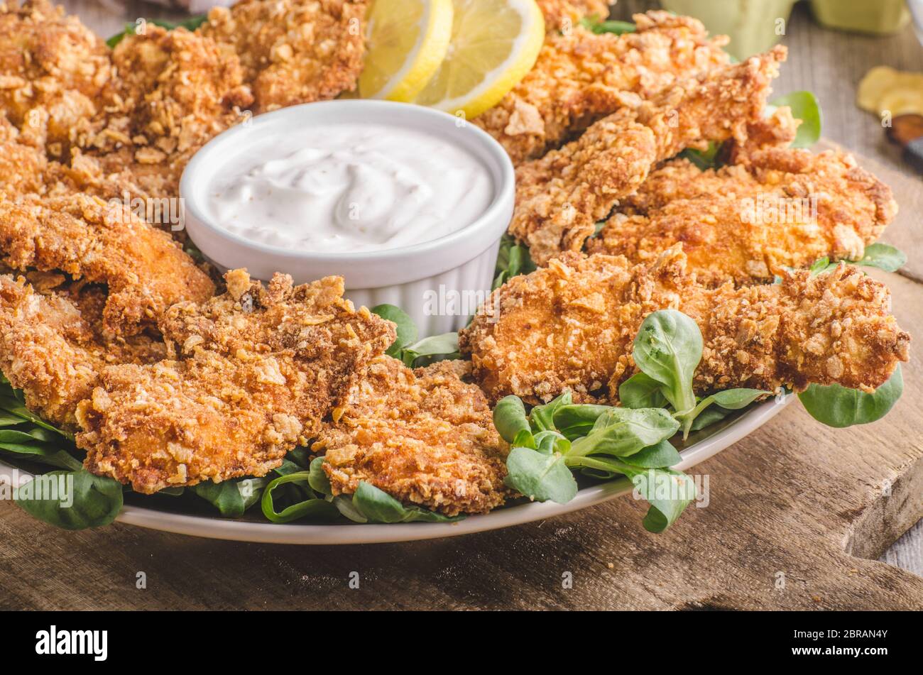 Chicken strips with delish garlic dip, food photography Stock Photo - Alamy