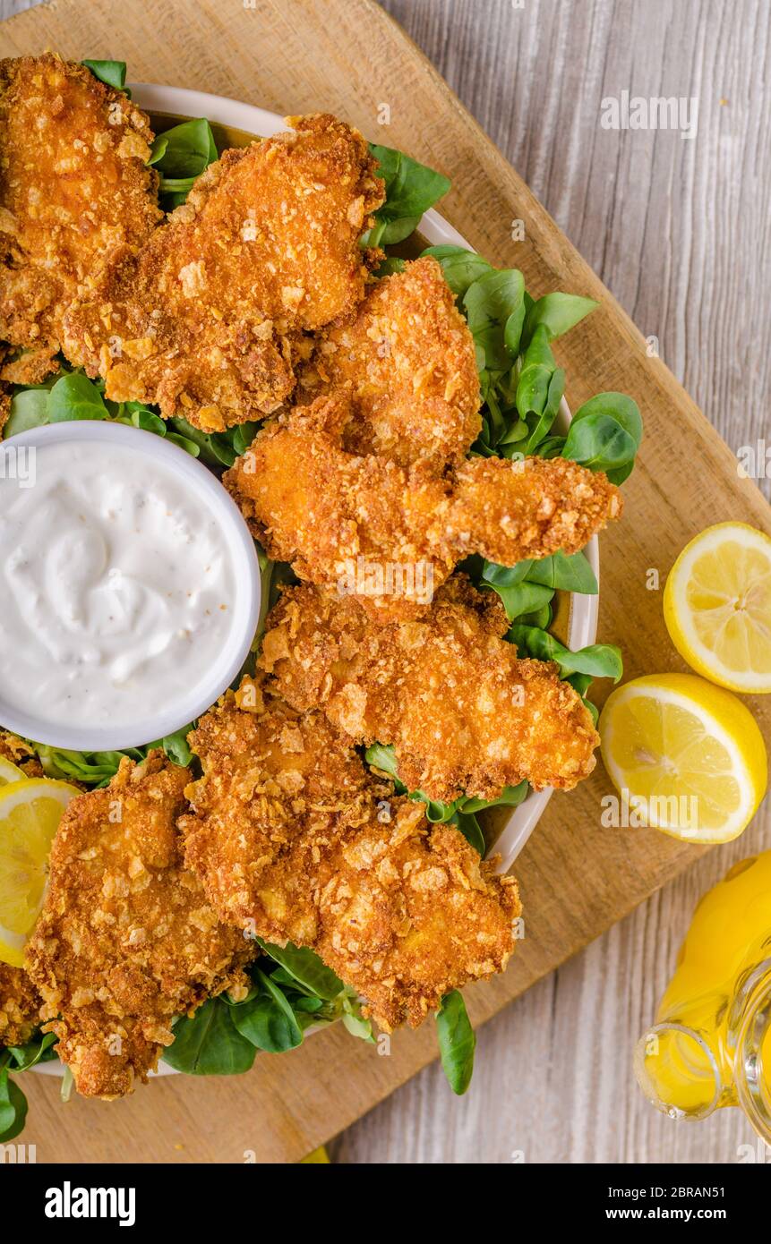 Chicken strips with delish garlic dip, food photography Stock Photo - Alamy