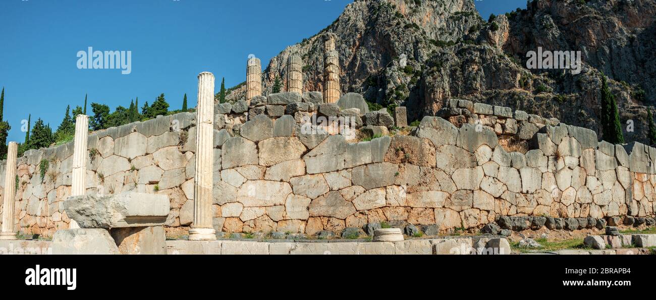 Famous polygonal wall of ancient greek city Delphi with columns of ...