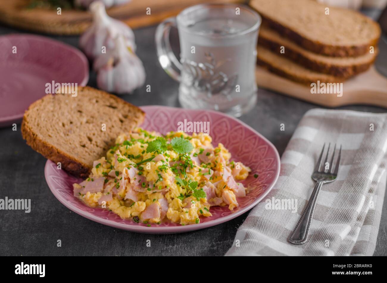 Scrambled eggs, wholegrain bread with fresh microgreens on top Stock ...