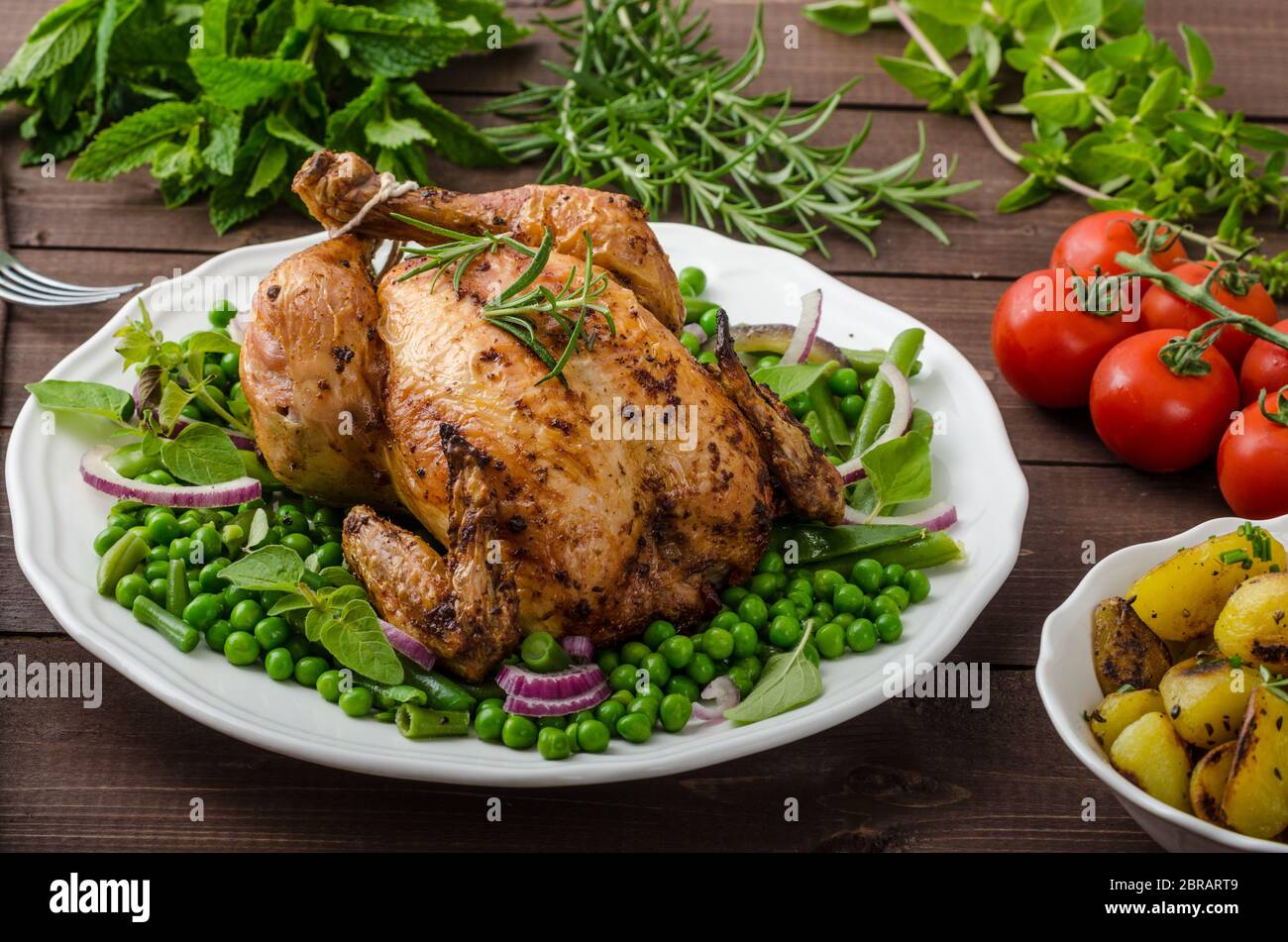 Grilled organic bio chicken, roasted potatoes, with spring vegetable ...