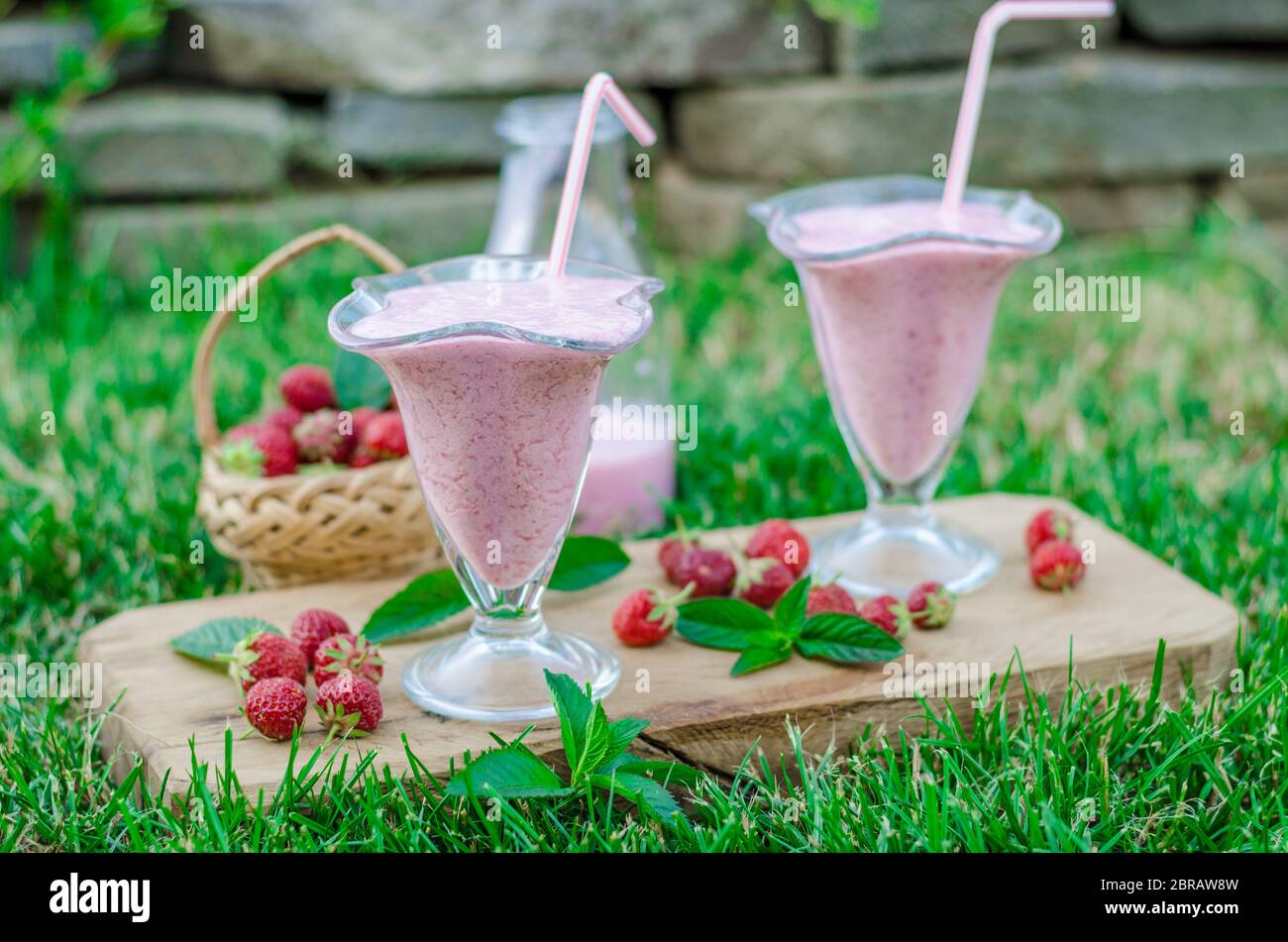 Strawberrie smoothie outside summer, basket with strawberries Stock ...